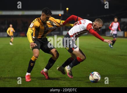 Cambridge United's Kyle Knoyle (left) and Scunthorpe United's Jem ...