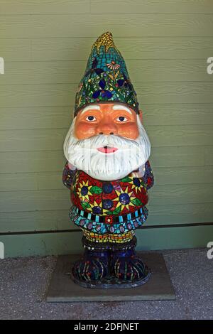 colorful garden gnome with a white beard at a place in the forest Stock ...