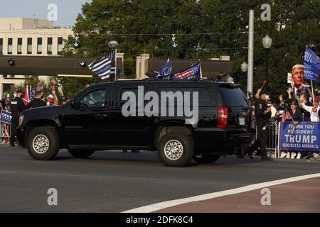 President Donald Trump drives past supporters gathered outside Walter ...