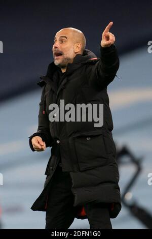 Manchester City's head coach Pep Guardiola greets supporters after the ...