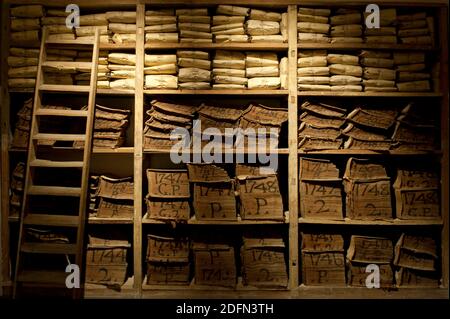 Medieval bookshelf with old books in the Old Royal Palace - Prague ...