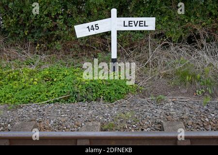 A trackside gradient marker, indicating the incline of the track on the ...