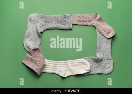 Frame made of warm socks on white background Stock Photo - Alamy