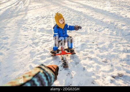Mother and baby on Snowmobile Stock Photo - Alamy