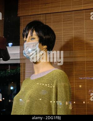 A display mannequin wearing a protective face mask is seen in Cannes ...