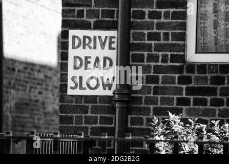 Drive Dead Slow Sign Stock Photo - Alamy