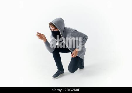 secretive masked man crouching sneaking robbery vandalism light ...