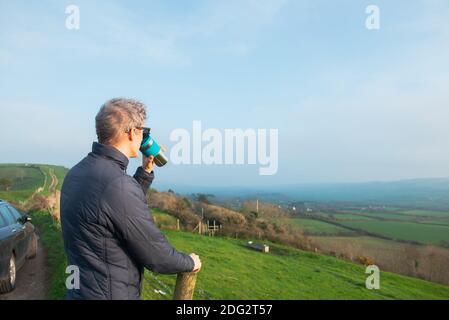 a blue cup from a thermos at an autumn picnic Stock Photo - Alamy