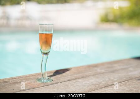 Glass of rose wine by the edge of a swimming pool at a pool party Stock ...