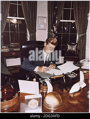 President Kennedy signs the Cuba Quarantine proclamation in the Oval ...