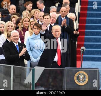 President Donald Trump waves as he arrives on Marine One at Joint Base ...
