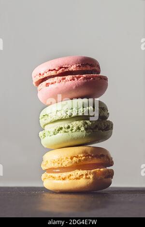 Row of delicious colorful French macaroons of different flavors ...