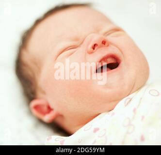 Close up of crying newborn baby Stock Photo - Alamy