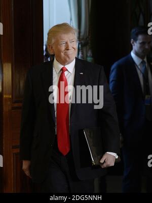 President Donald Trump arrives to speak about the economy at a rally ...