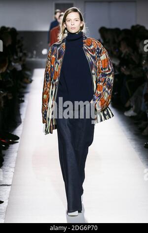 A model walks the runway at the Dries Van Noten show during Paris ...
