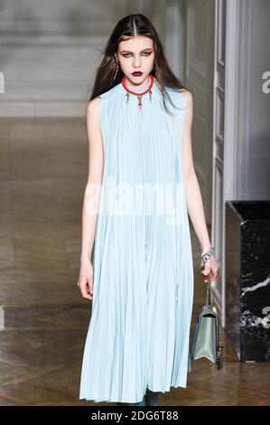 A model walks the runway at the Valentino show during Paris Men's ...
