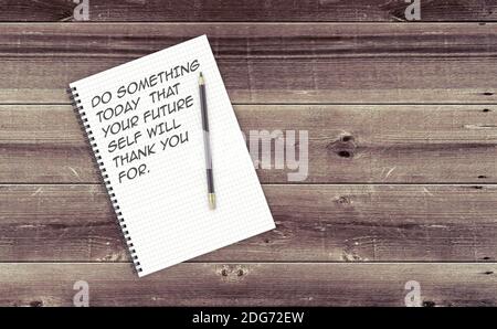 Inspirational quote on notepad Stock Photo - Alamy