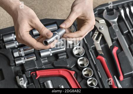 Open toolbox and male hands Stock Photo - Alamy