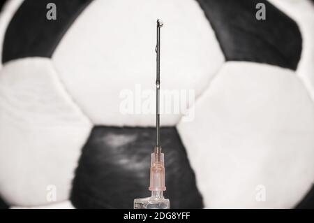 Soccer ball gets an injection with a syringe, doping in sports Stock ...