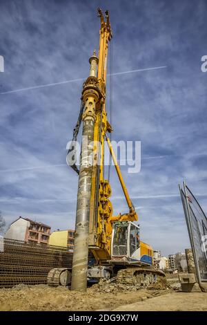 Excavation machine for digging soil and asphalt Stock Photo - Alamy
