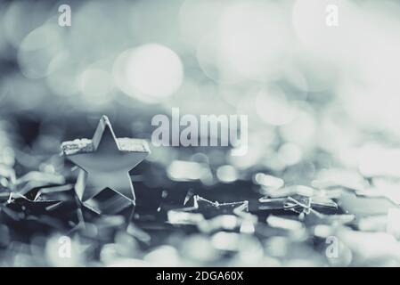 Macro photo of silver star with light bokeh Stock Photo - Alamy