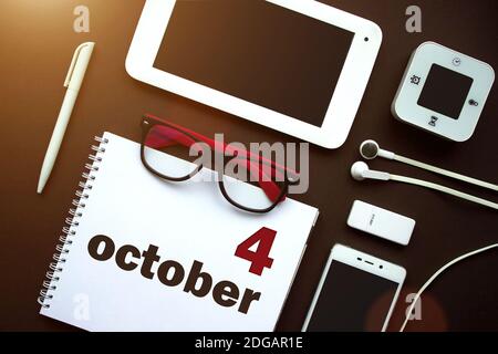 october 4th. Day 4 of month, date in frame next to succulent on wooden ...