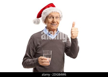 Santa claus drinking a glass of water isolated on white background ...