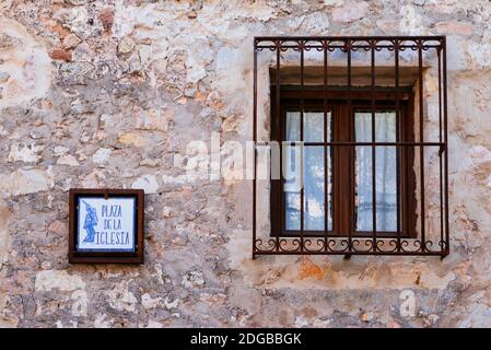 Iron bars of the old house. It has ornaments with red hearts and fake ...