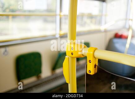 The plastic handles on the interior of the bus provide a secure grip ...