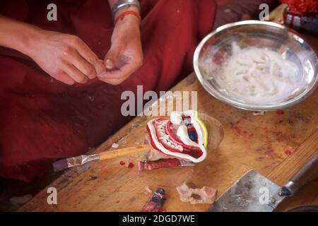Preparations for the Zanskar / Karsha Gustor festival. A monk makes an ...