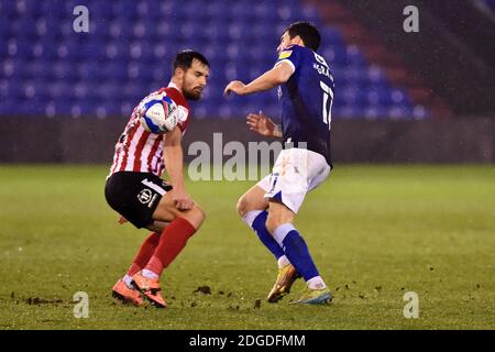 Oldham Athletic's Bobby Grant tussles with Callum Cooke of Bradford ...