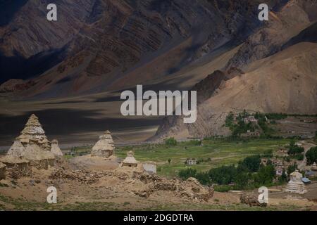 Stupas scattered on the hillside beneath Zangla Palace, Tsa-zar ...