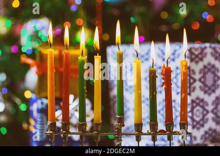 Closeup of a burning Chanukah candlestick with candles Menorah a ...