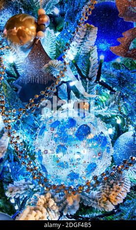 Closeup of a beautifully decorated Christmas tree with illuminated lights and copy space Stock ...