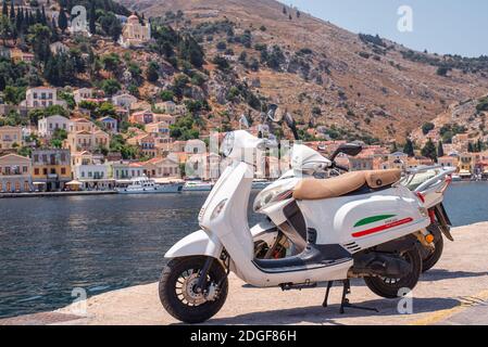 A beautiful view of the Symi Harbor on Symi Island, Greece with boats ...