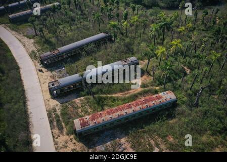 There are piles of abandoned green-skinned trains on the train ...