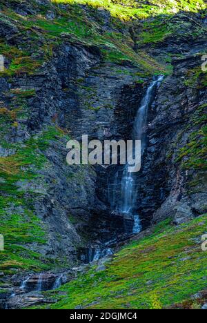 Waterfall free falling from a steep mountain slope Stock Photo - Alamy