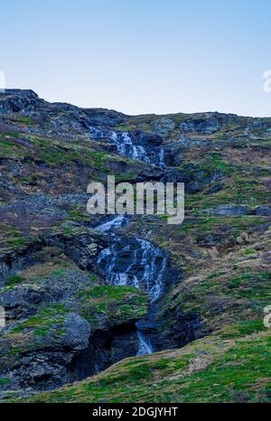 Waterfall free falling from a steep mountain slope Stock Photo - Alamy