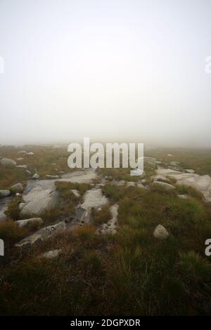 A misty landscape of the Island of Arran in Scotland, beside the sea ...
