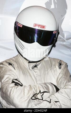 The Stig promotes Scalextric's Top Gear race track at the Toy Fair ...