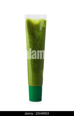 Wasabi paste in plastic container on white background Stock Photo - Alamy