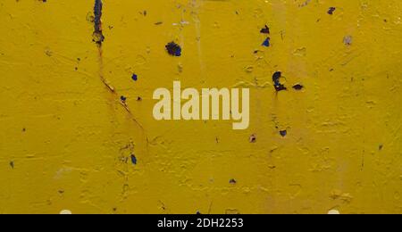 Scuffed and rusting old yellow metal background with copy space Stock ...