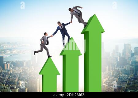 Colleagues helping each other to improve the results Stock Photo - Alamy