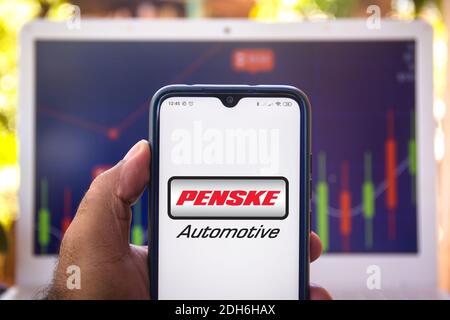 In this photo illustration, the Penske Automotive company logo is seen ...