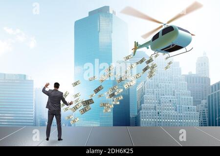 Helicopter money concept with the businessman Stock Photo - Alamy