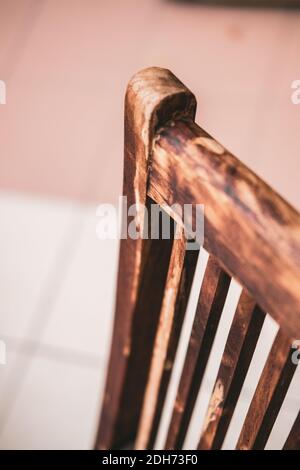A vertical high angle shot of wooden pawns in a web network blocked by ...