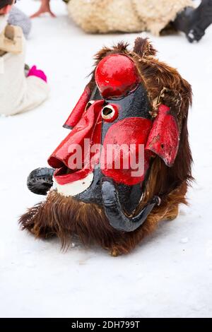 Masks of bulgarian traditional carnival kuker costume in the snow Stock ...
