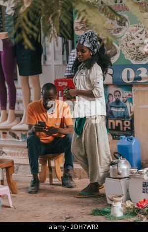 Ethiopian traditional Coffee ceremony women preparing bunna coffee in Addis Ababa, Ethiopia ...