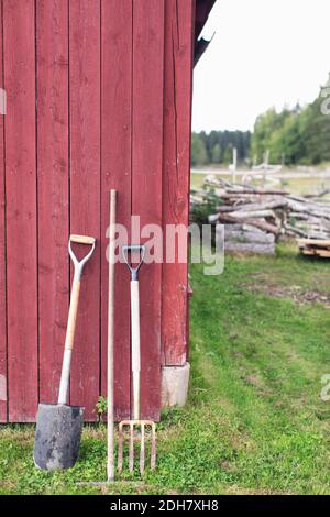 Farm tools in barn Stock Photo - Alamy
