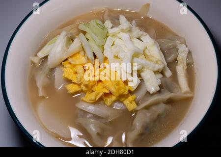 Rice cake soup with dumplings Stock Photo - Alamy